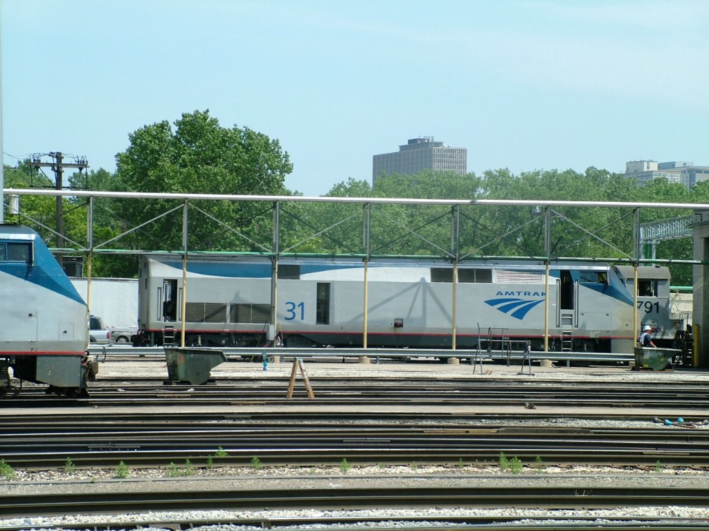 AMTK 31 behind some pipes